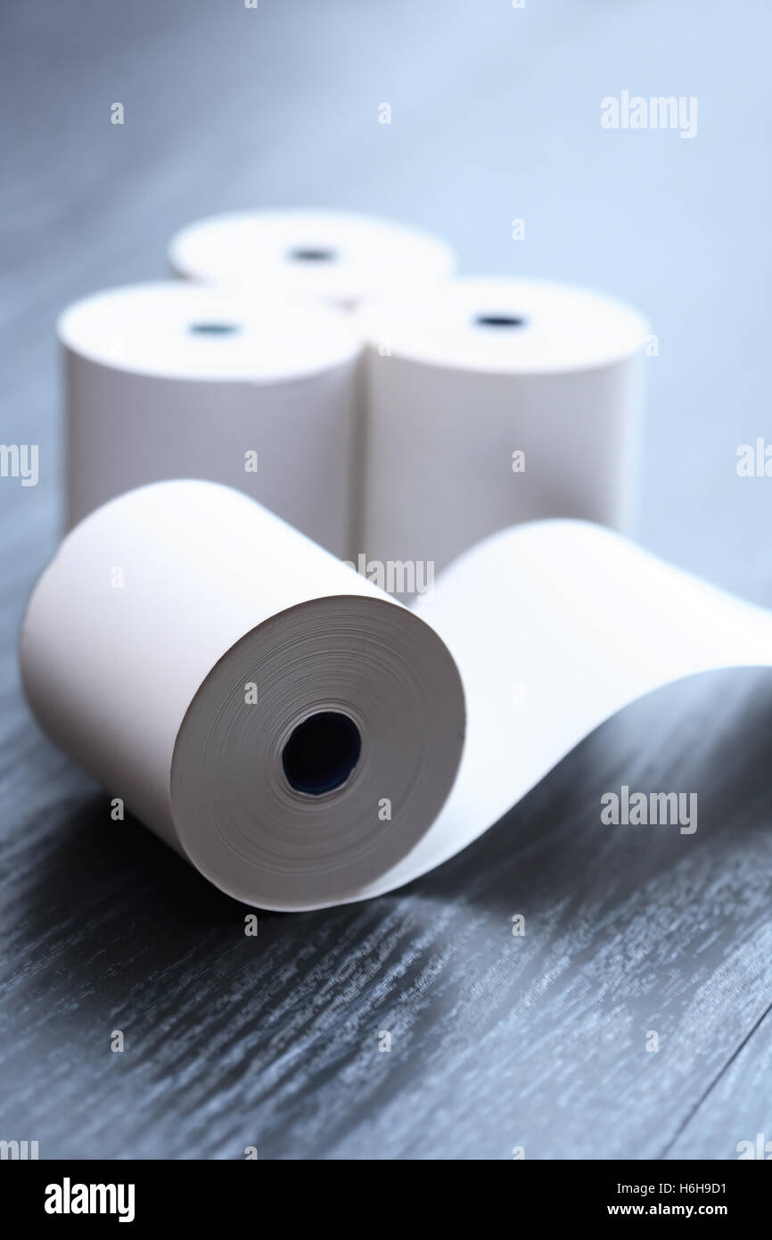 Set of white paper rolls on dark background Stock Photo - Alamy