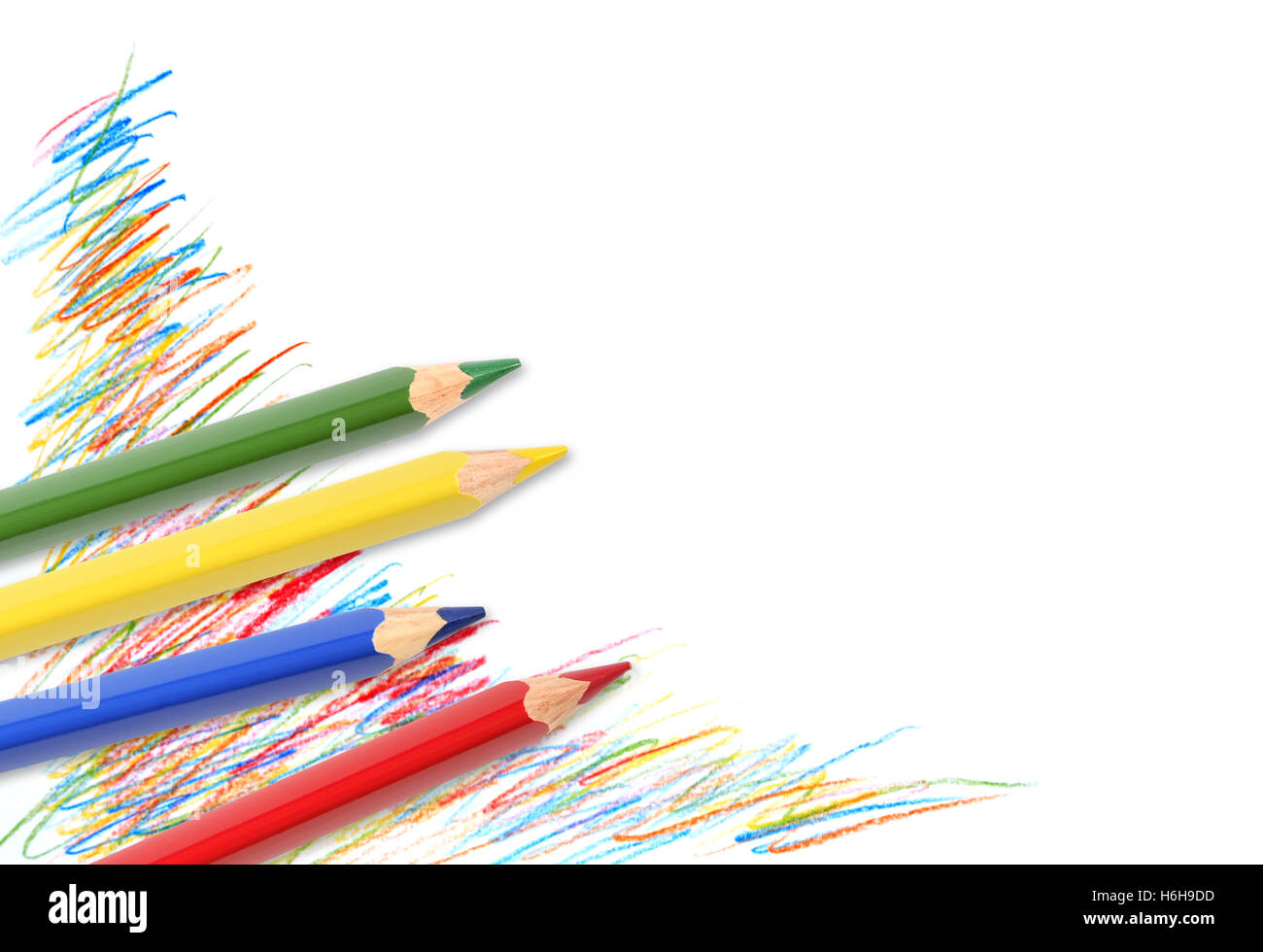 Few color pencils on white paper with abstract drawing Stock Photo - Alamy