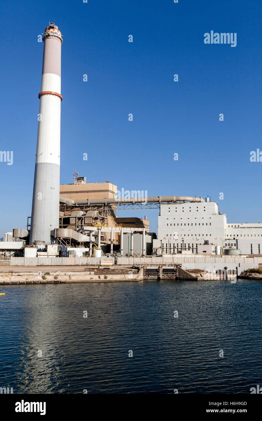 Fossil fuel power plant on a sunny day against clear sky Stock Photo ...