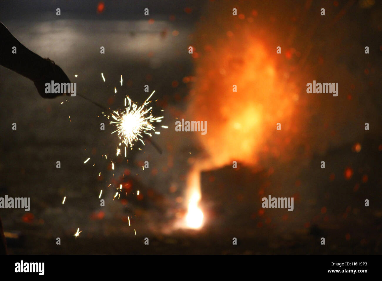 Bright sparkler firework in hand Stock Photo - Alamy