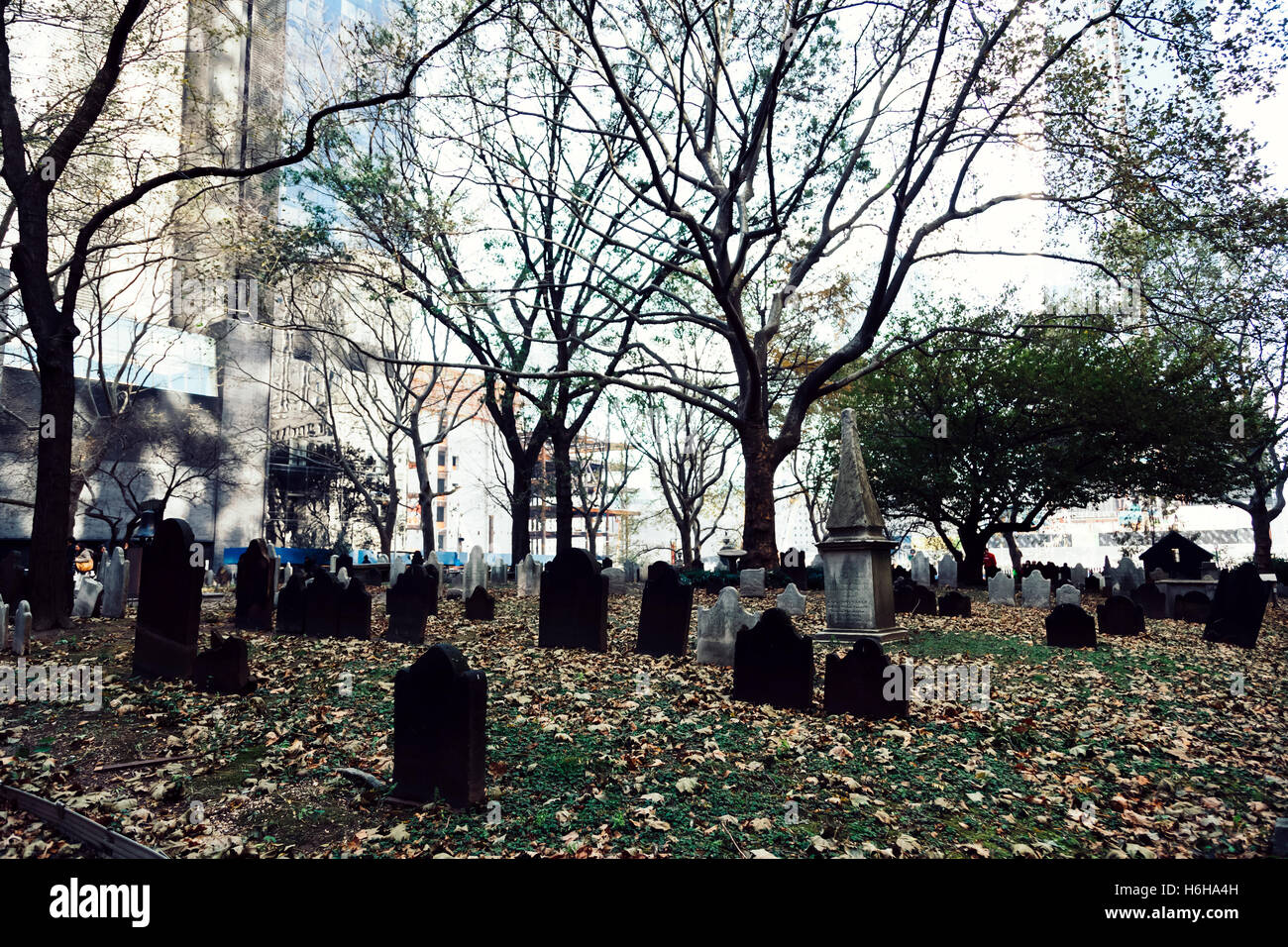 Tombstones in a graveyard by a church Stock Photo - Alamy