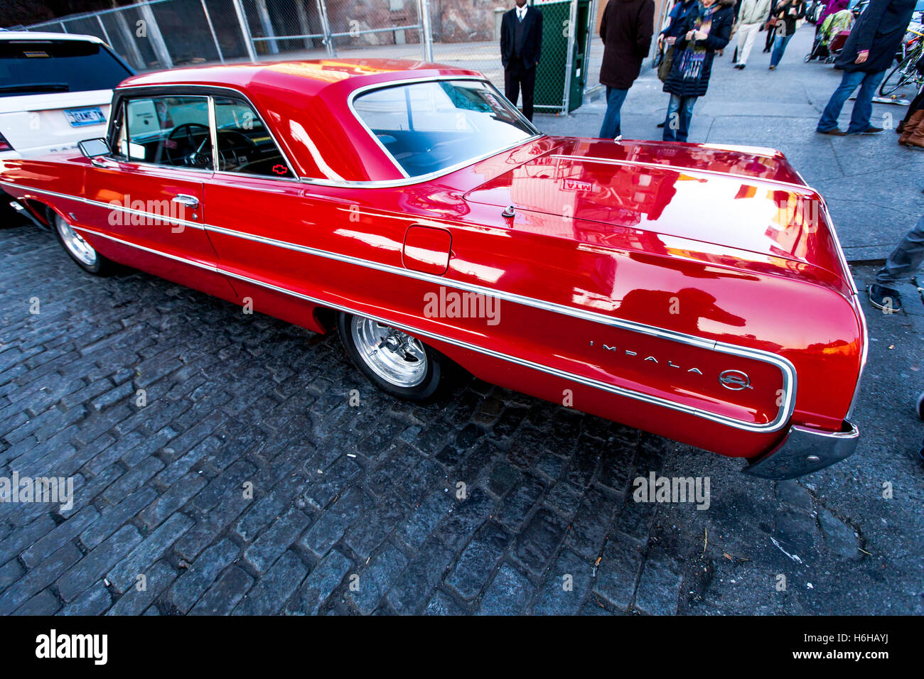 NEW-YORK - NOV 17: Vintage Red Chevrolet Impala parked on the curb of a ...