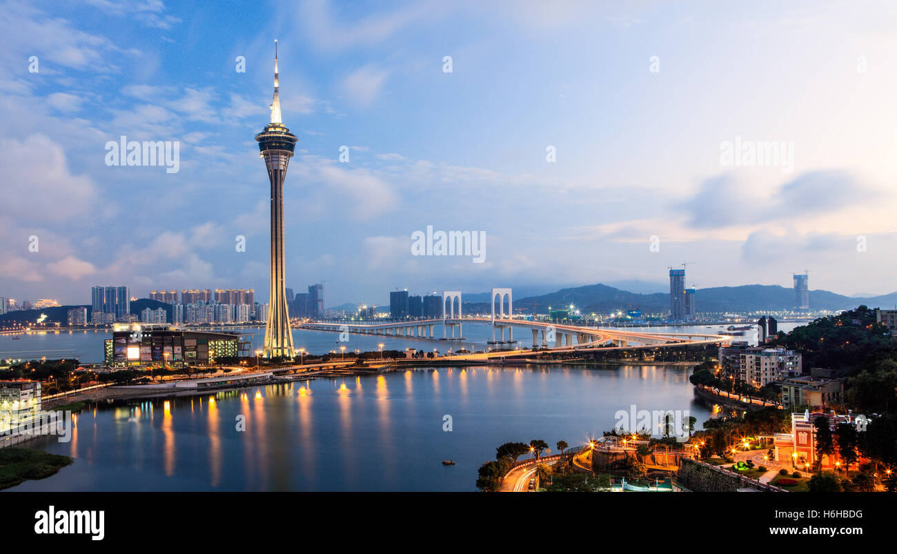 The Macau Tower with the view of the Sai Van Bridge during twilight ...