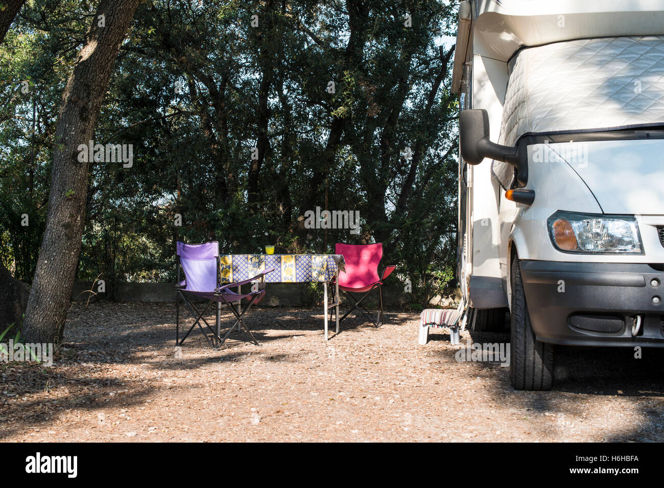 Camper in campsite at the morning sunrise Stock Photo - Alamy