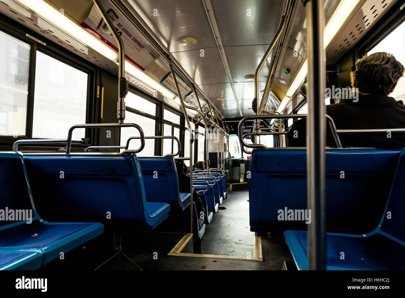 NEW-YORK - NOV 14: A few people in a rather vacant city bus in New-York ...
