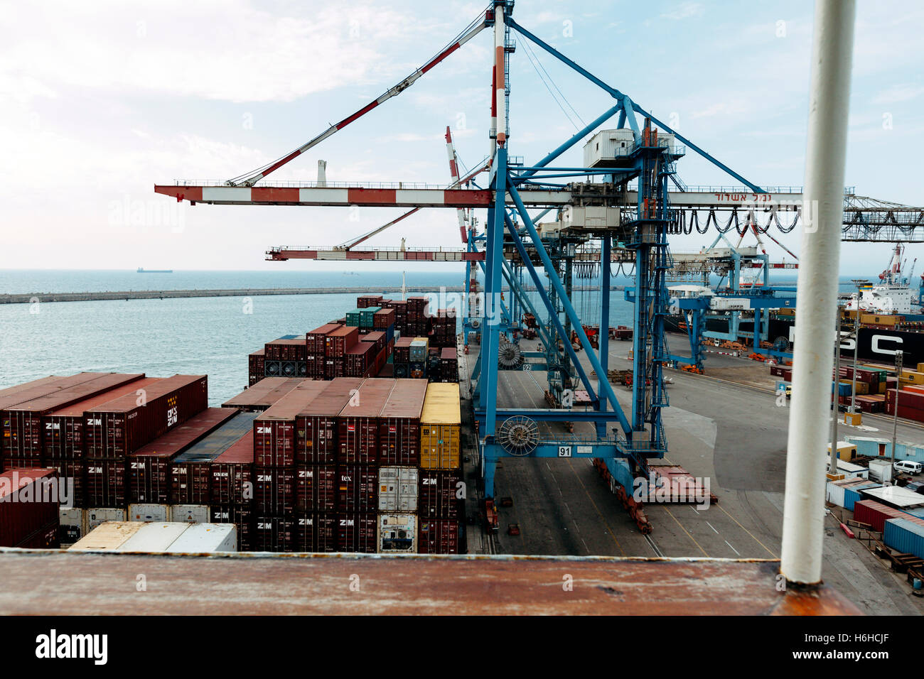 ASHDOD, ISRAEL - OCTOBER 12: Massive Harbor cranes, container stacks ...