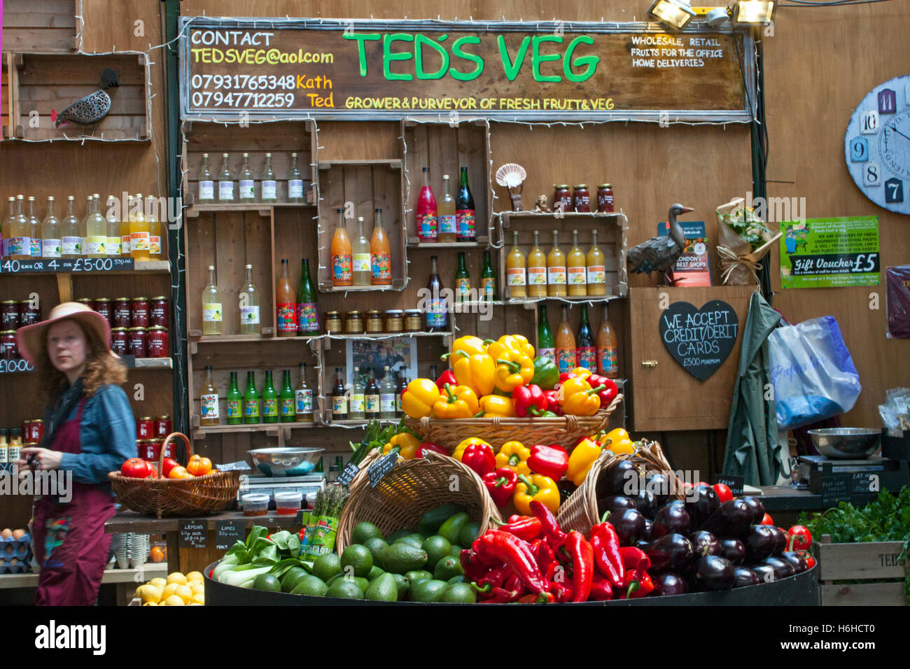 Red and yellow peppers on a vegetable stall in Borough Market in ...