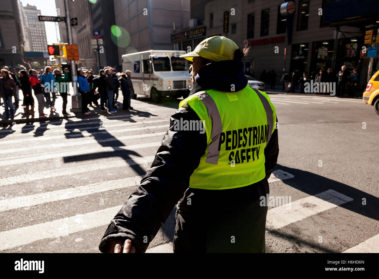 NEW-YORK - NOV 9: A pedestrian safety worker managing the traffic of ...