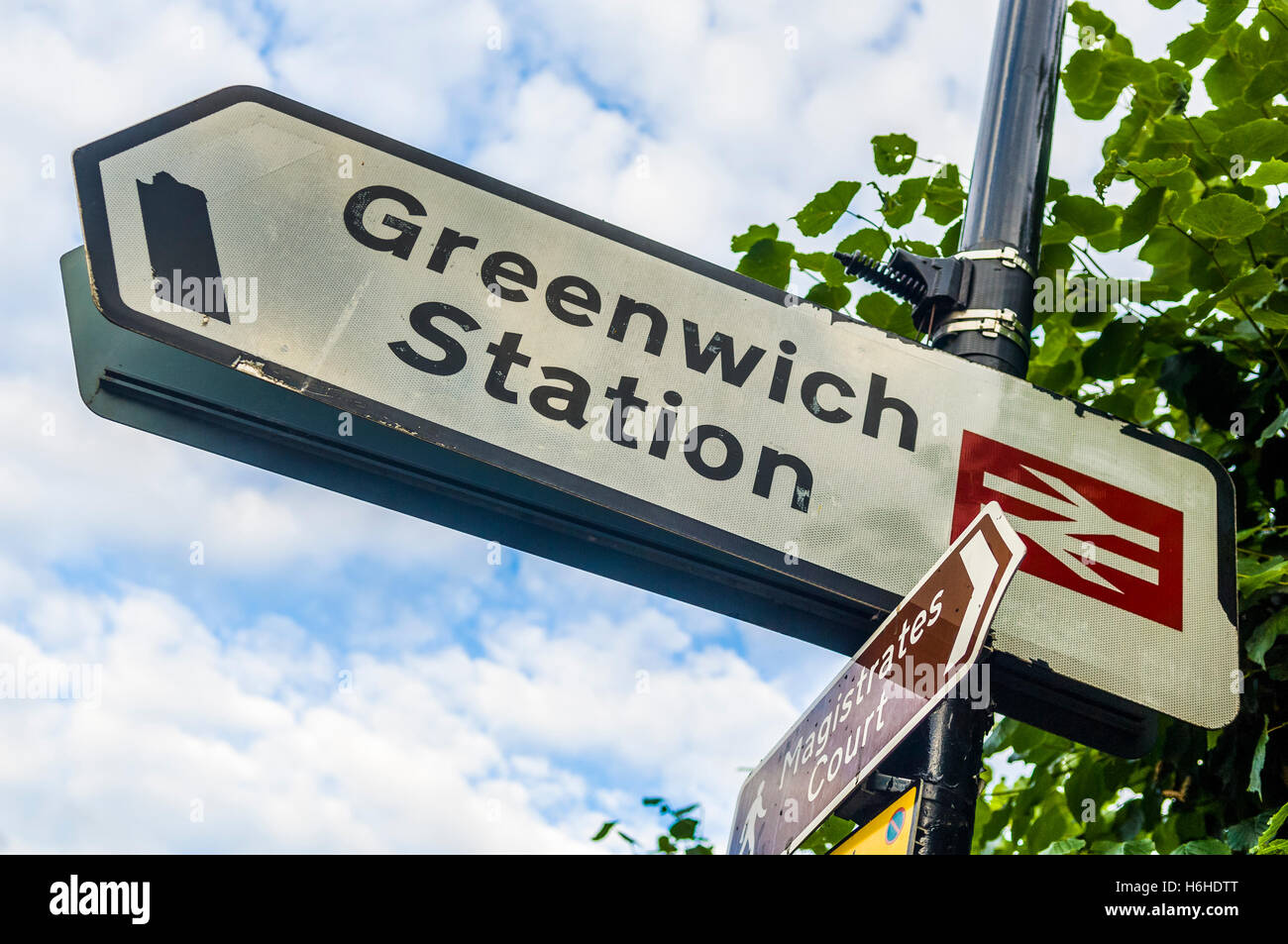 London street sign indicating the direction to Greenwich Station Stock ...
