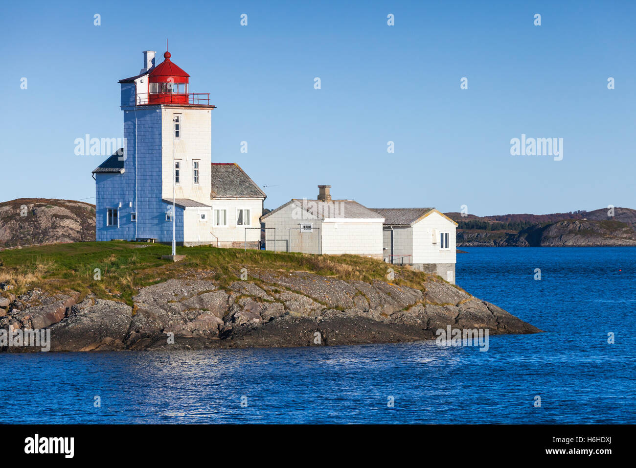 Tyrhaug Lighthouse, white tower with red light. Coastal lighthouse ...