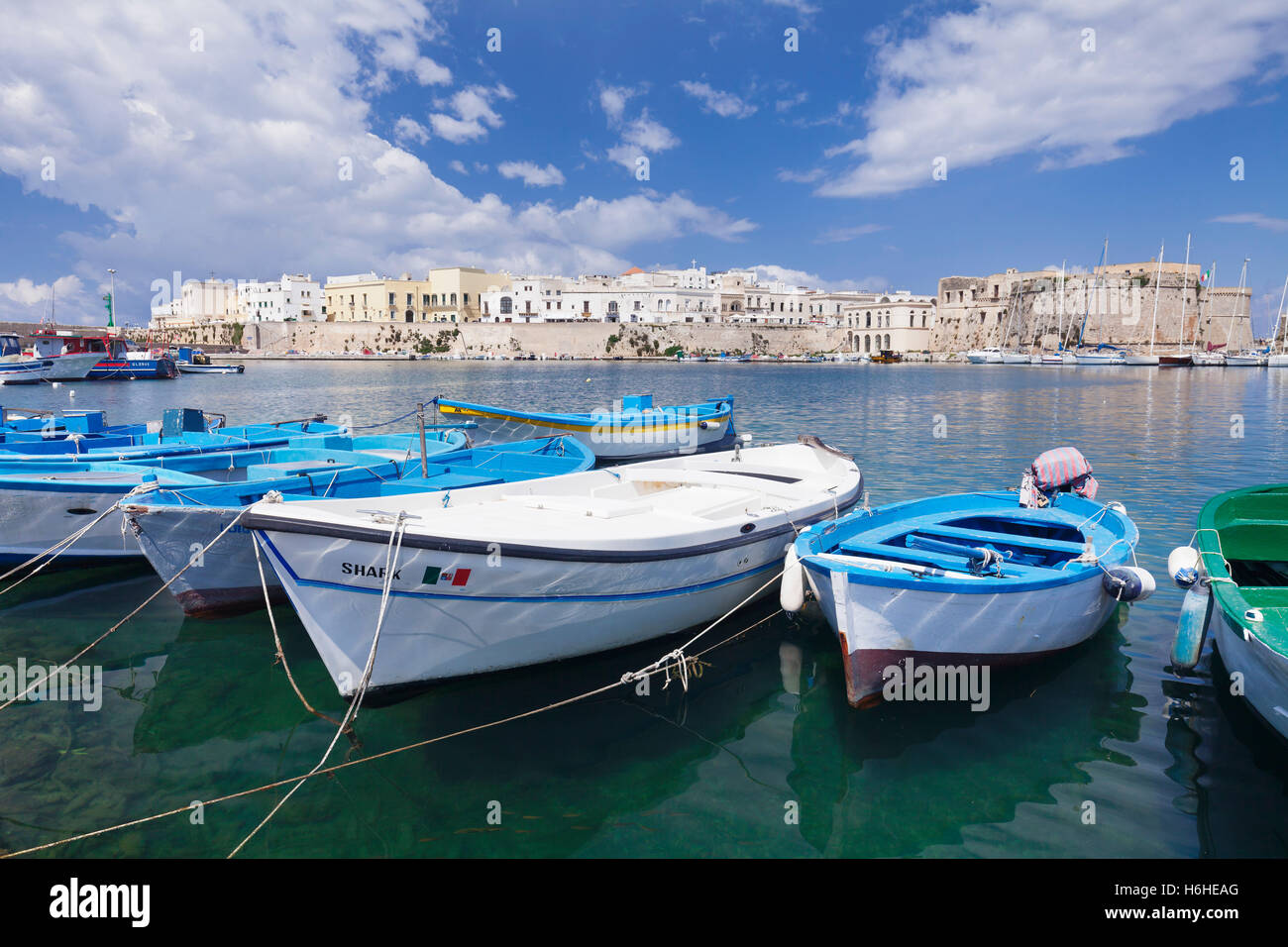 Fishing boats in harbor with View of the historic centre with castle ...