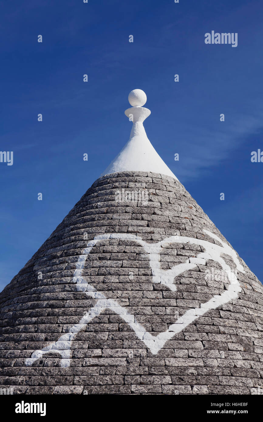 Round slate roof with heart, Trulli House, District Monti, Alberobello ...
