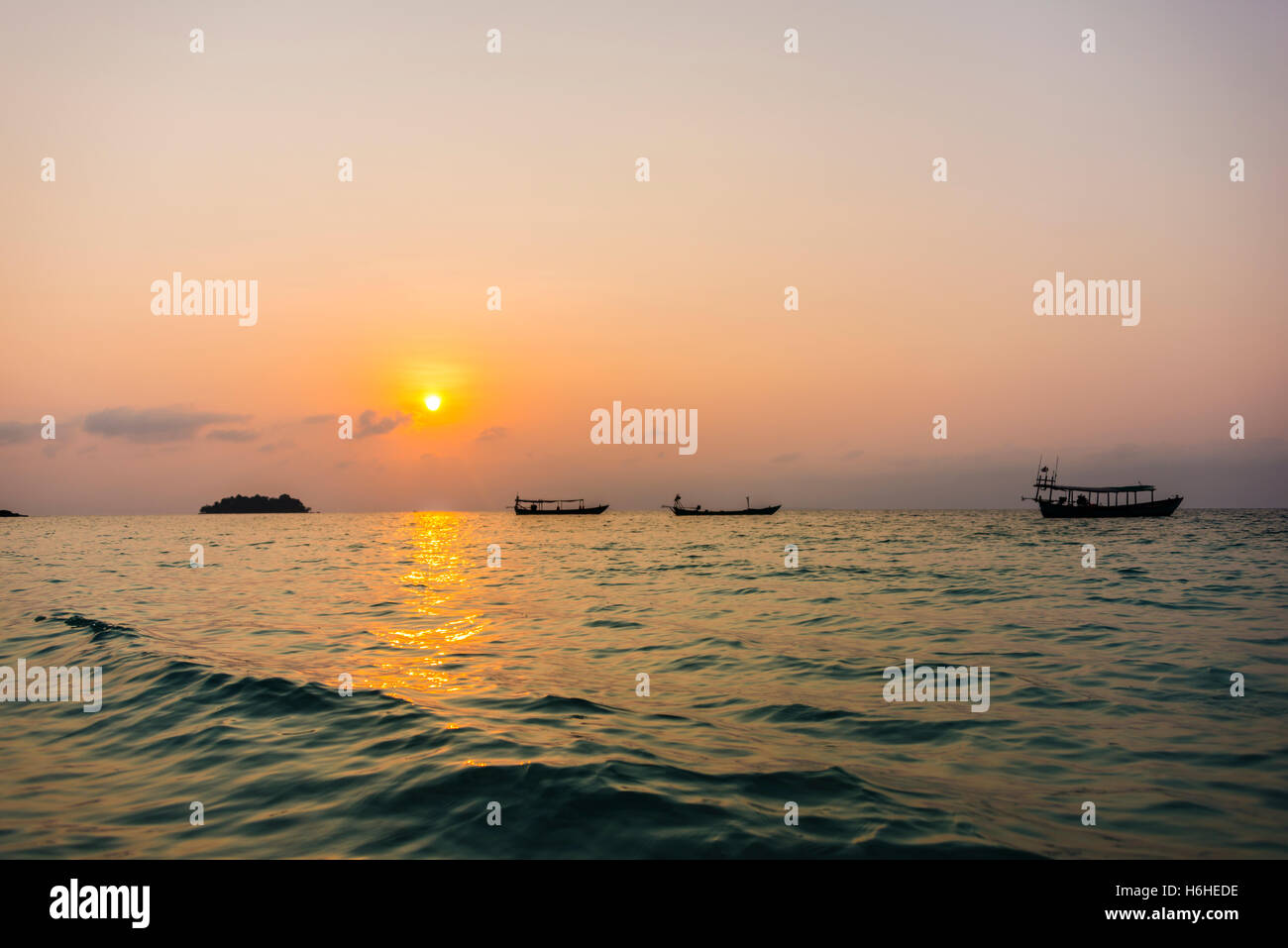 Boats on sea at sunrise from Koh Tui Beach, Koh Touch village, Koh Rong ...