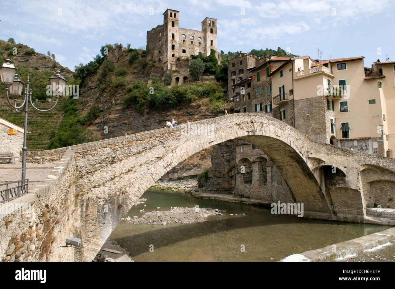 Arch bridge and Castello Doria, mountain village Dolceacqua in the ...