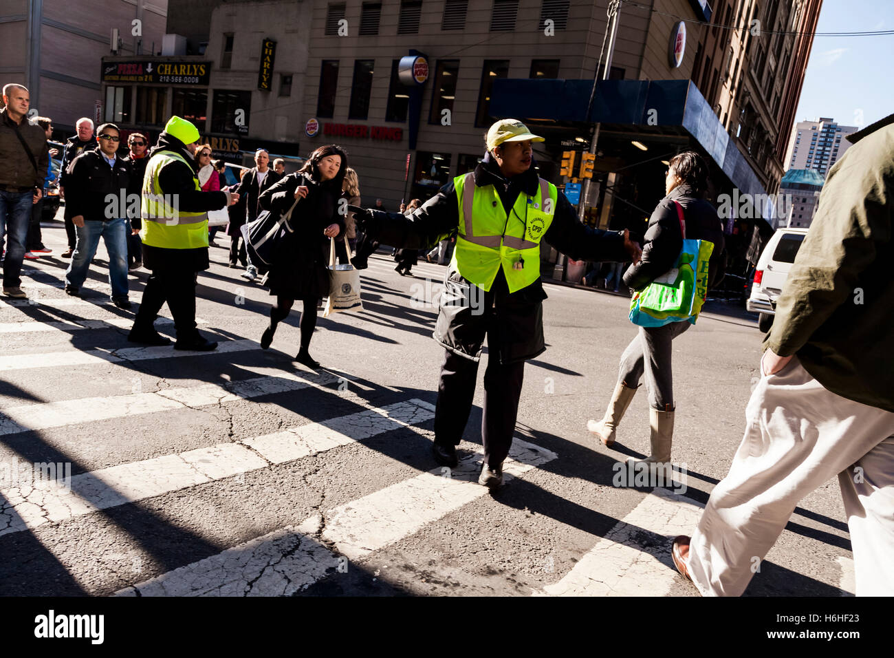 NEW-YORK - NOV 9: A pedestrian safety worker managing the traffic of ...