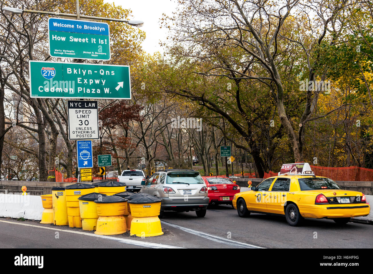 Several traffic signs at one of the entrances to Brooklyn, New York ...