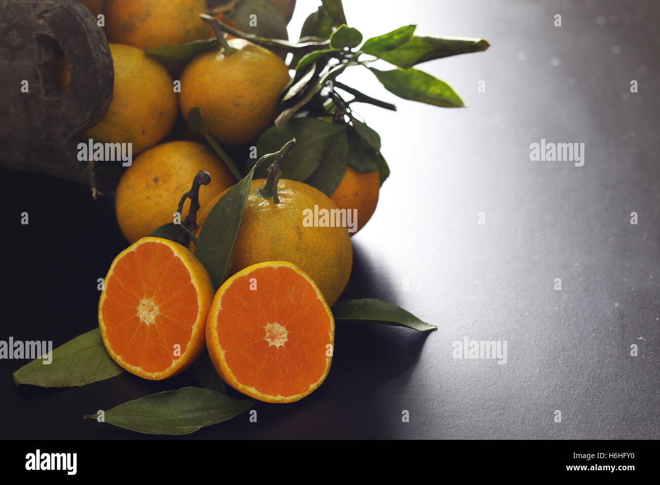 mandarin fruit isolate black Stock Photo - Alamy