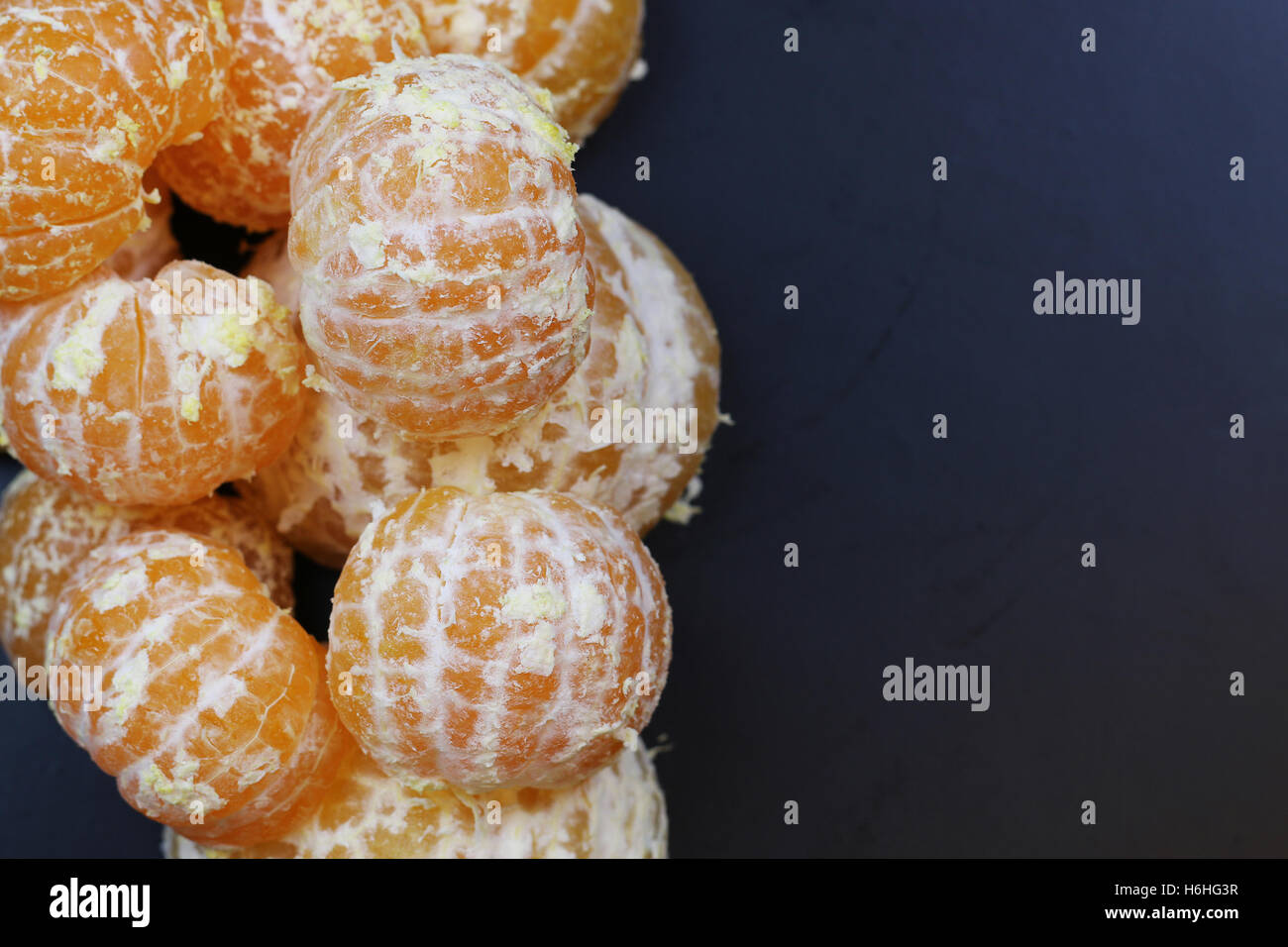 mandarin fruit isolate black Stock Photo - Alamy
