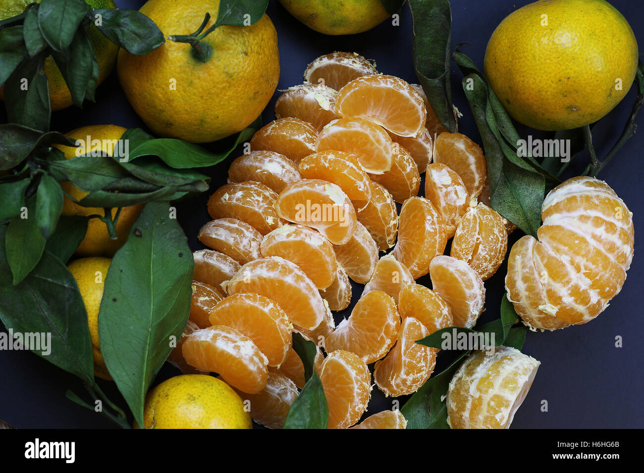 mandarin fruit isolate black Stock Photo - Alamy