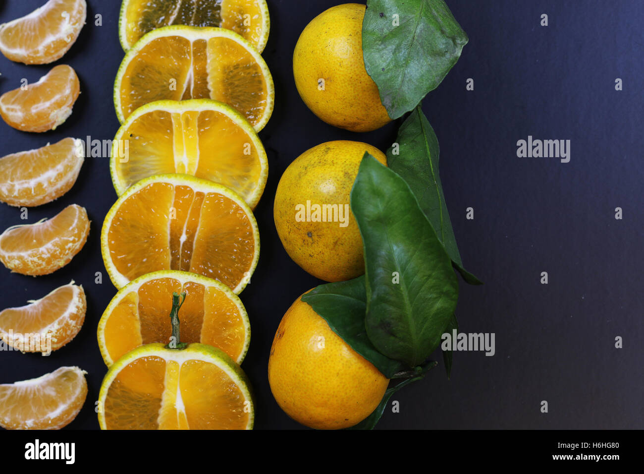 mandarin fruit isolate black Stock Photo - Alamy
