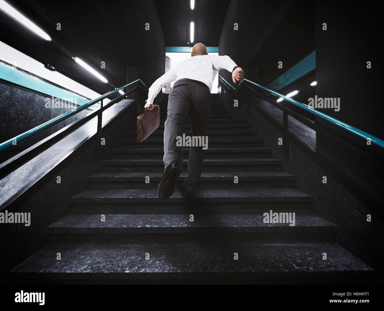 Business man running stairs hi-res stock photography and images - Alamy