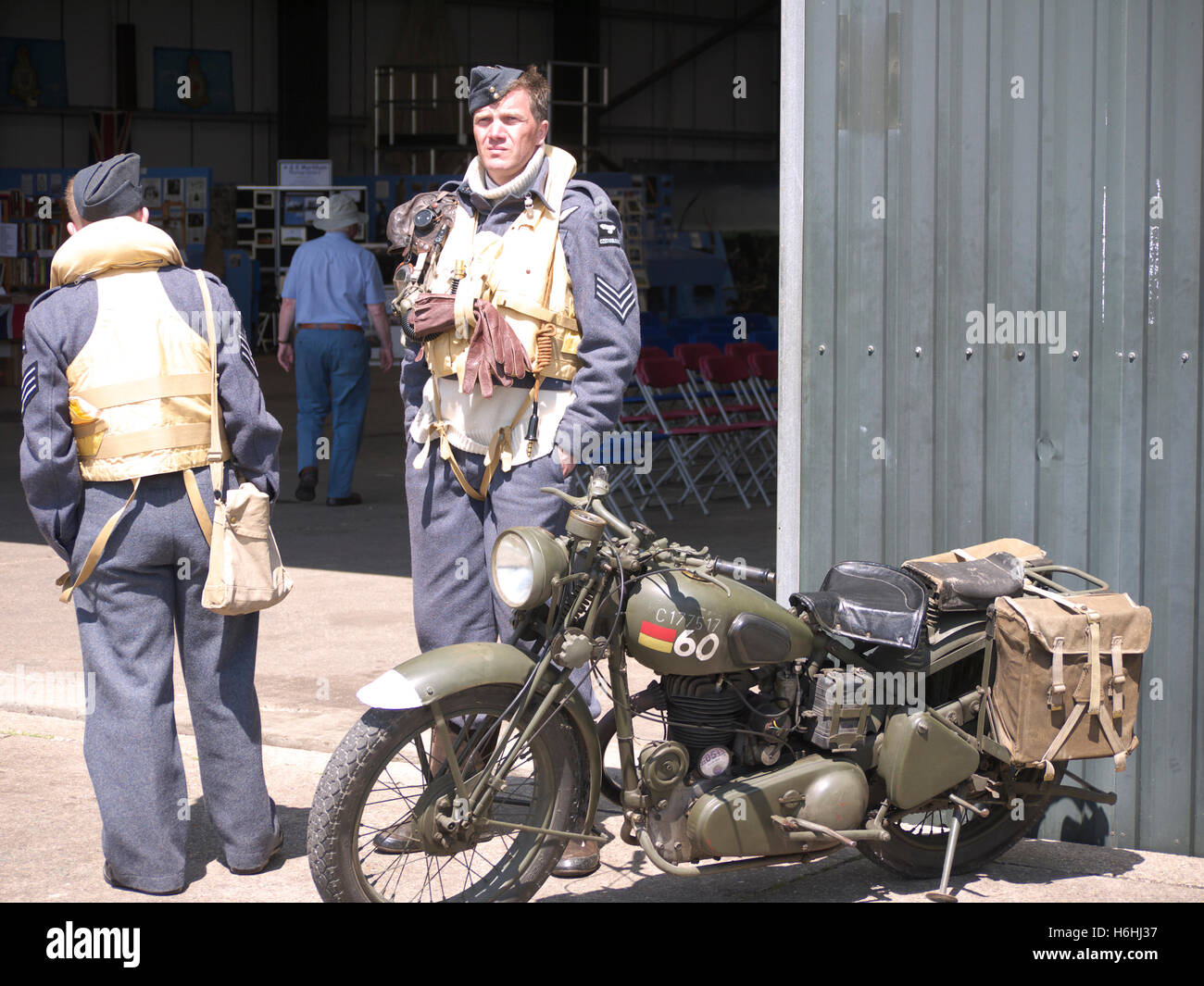 Reenactors portraying WWII Raf members and a Vintage WWII motorbike ...