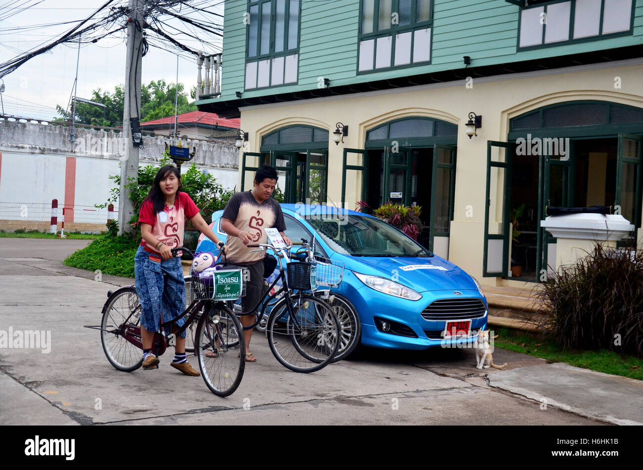Traveller thai people posing with bicycles stop at classic house lanna style at Nan city on July ...