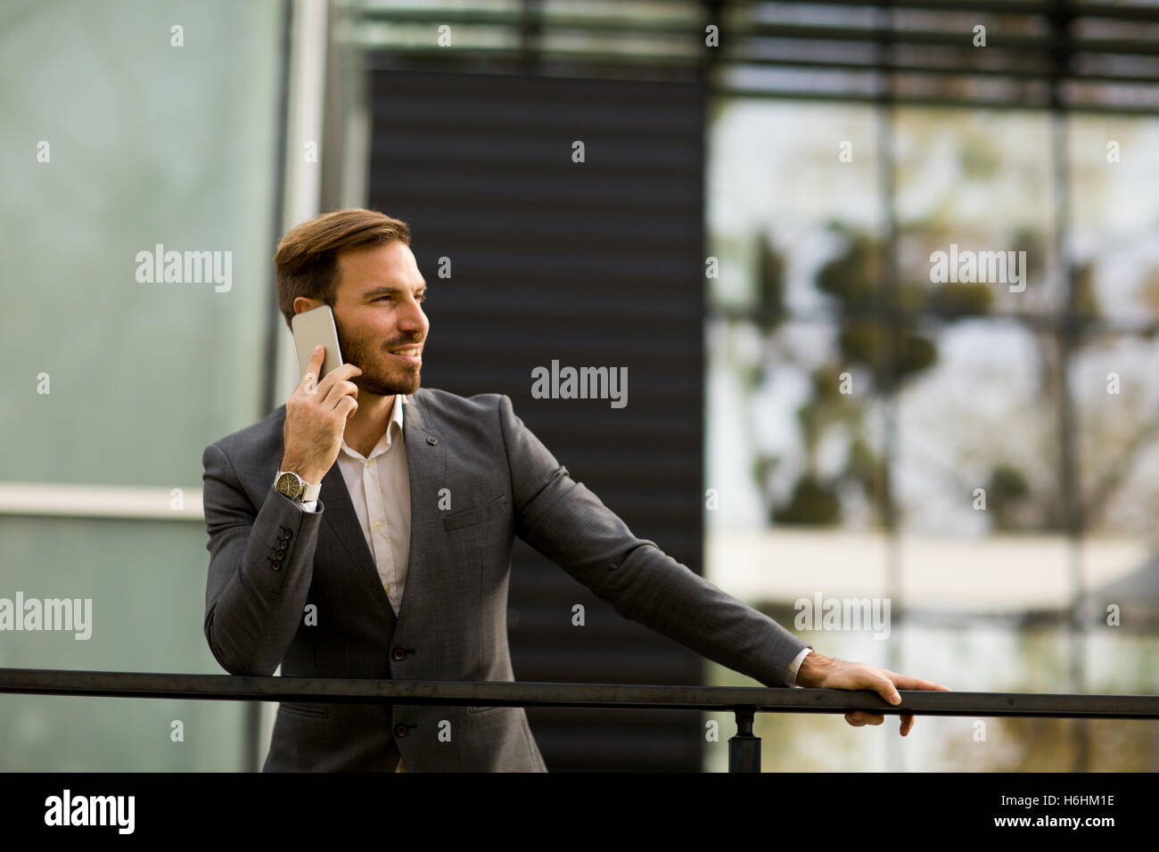 Modern businessman talking over the phone in the office Stock Photo - Alamy