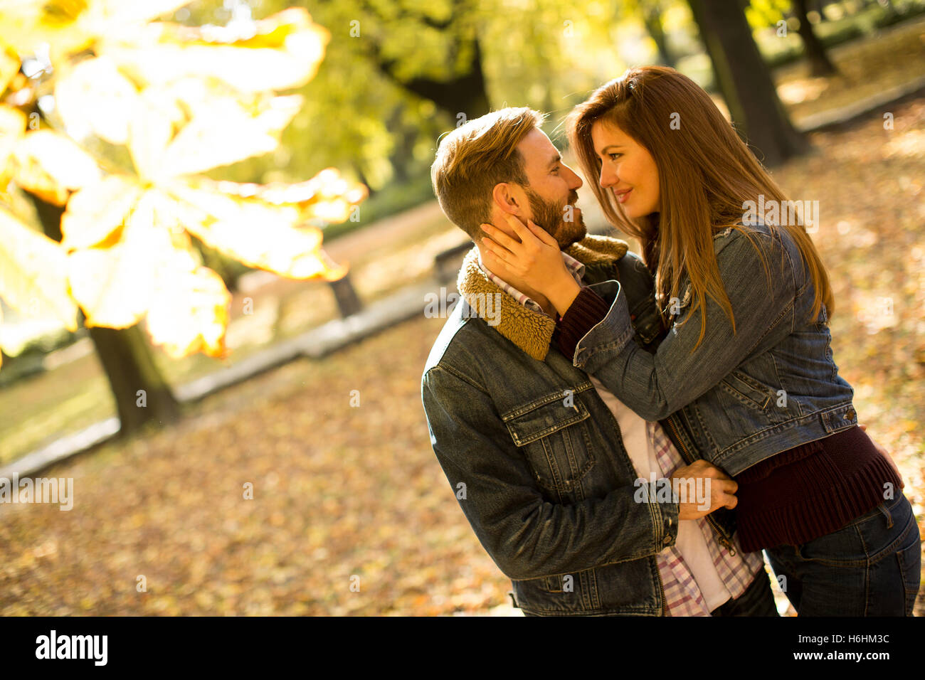 Loving couple in the autumn park Stock Photo - Alamy