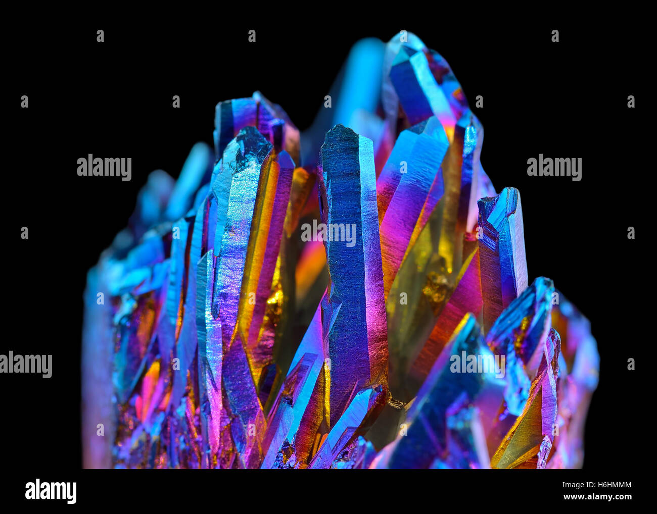 Quartz Rainbow Titanium aura crystal cluster on black background Stock ...
