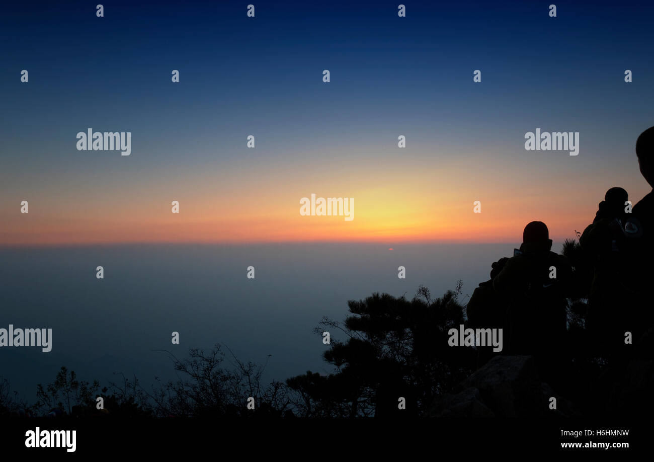 Sun rising over the Taishan Mountain range in Shandong province China ...