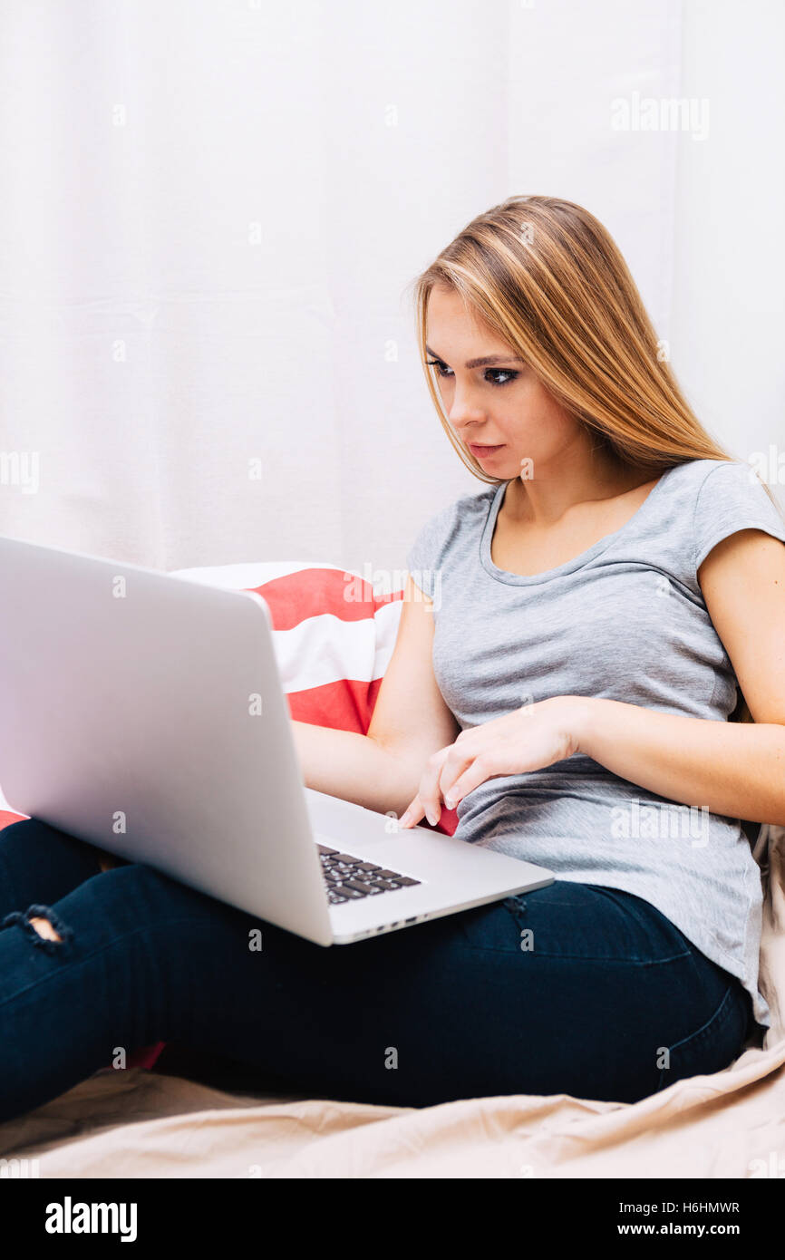 Young girl using laptop Stock Photo - Alamy