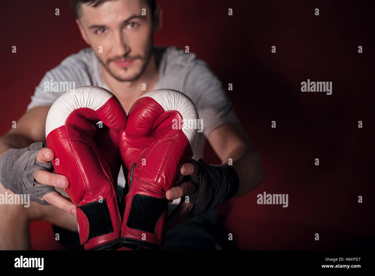Holding boxing gloves hi-res stock photography and images - Alamy