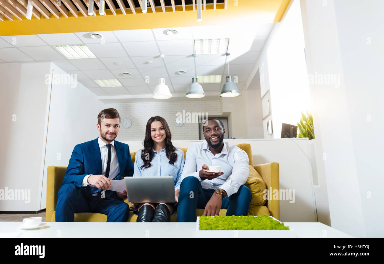 Positive colleagues resting together Stock Photo - Alamy