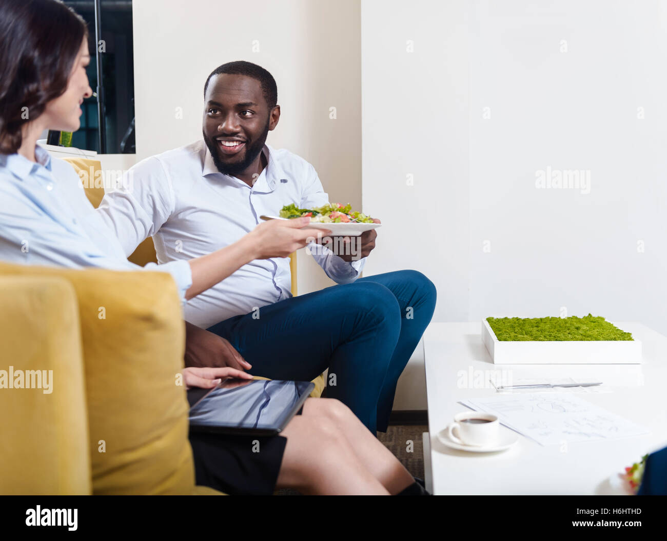 Positive colleagues having lunch Stock Photo - Alamy