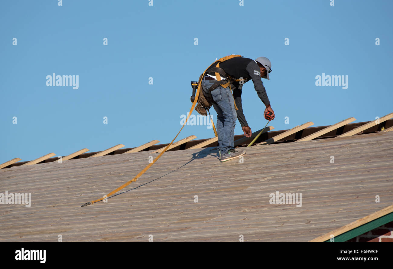 On roof wearing harness hi-res stock photography and images - Alamy