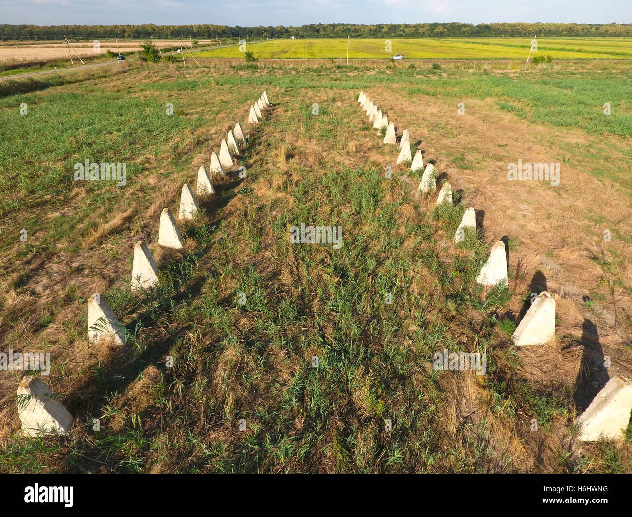 The ruins of the old farm. Cones column base of the wall. Abandoned and ...