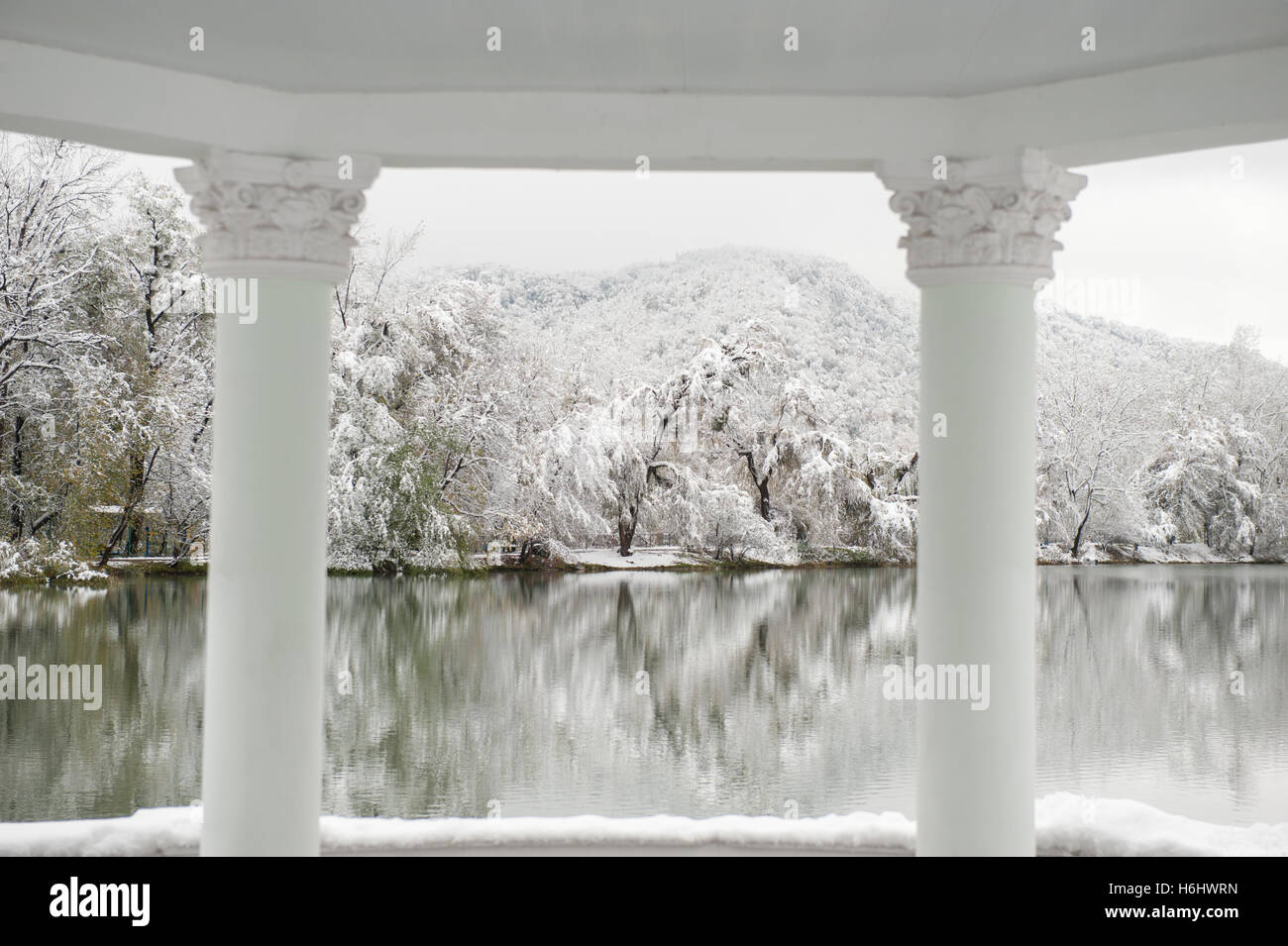 beautiful columns on background of lake and winter park Stock Photo - Alamy