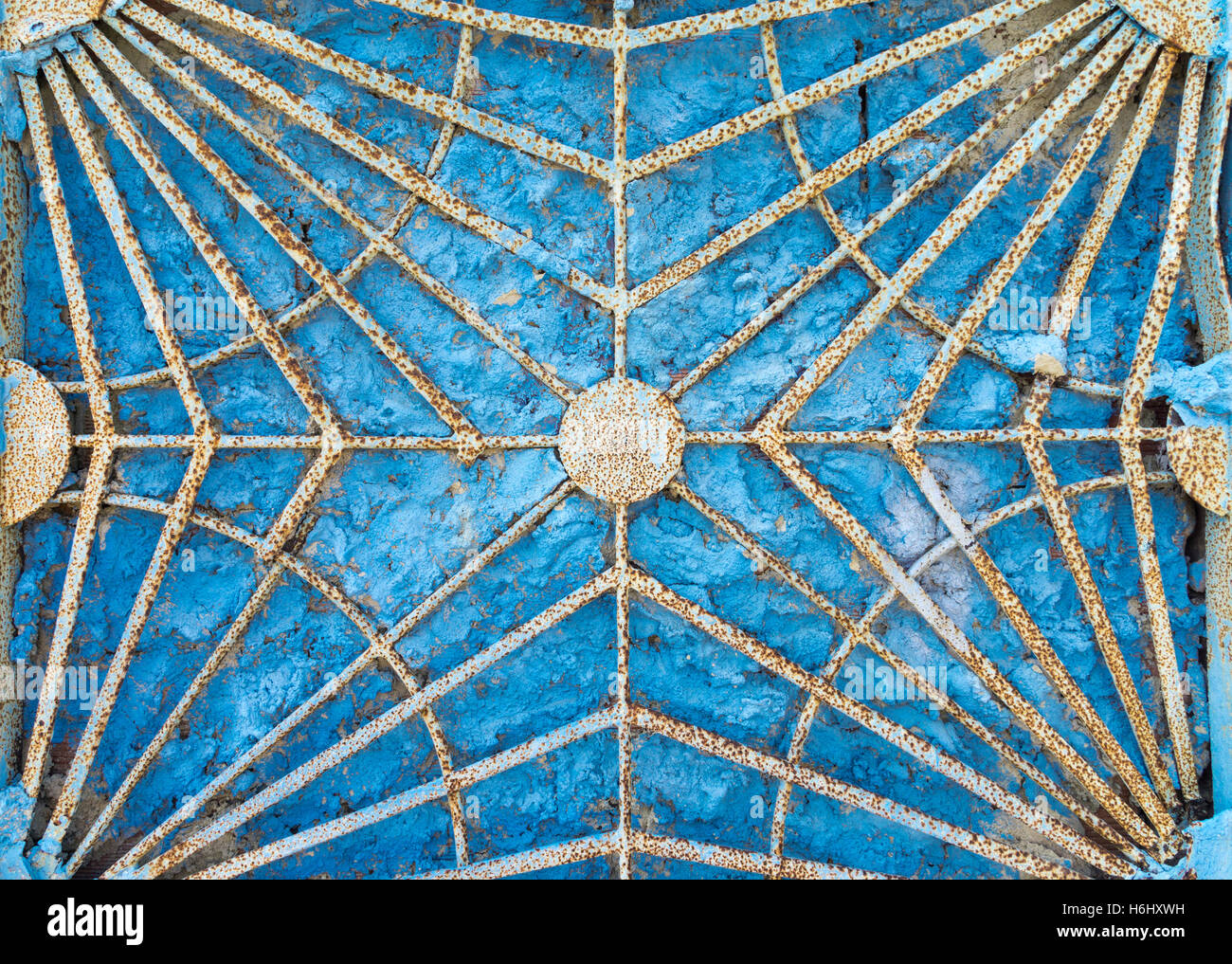 A grill, or reja covering a boarded up window in Spain Stock Photo - Alamy