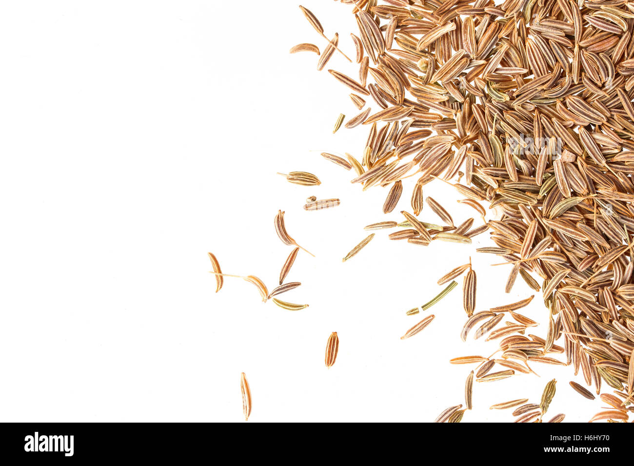 Cumin seeds isolated on white background Stock Photo - Alamy