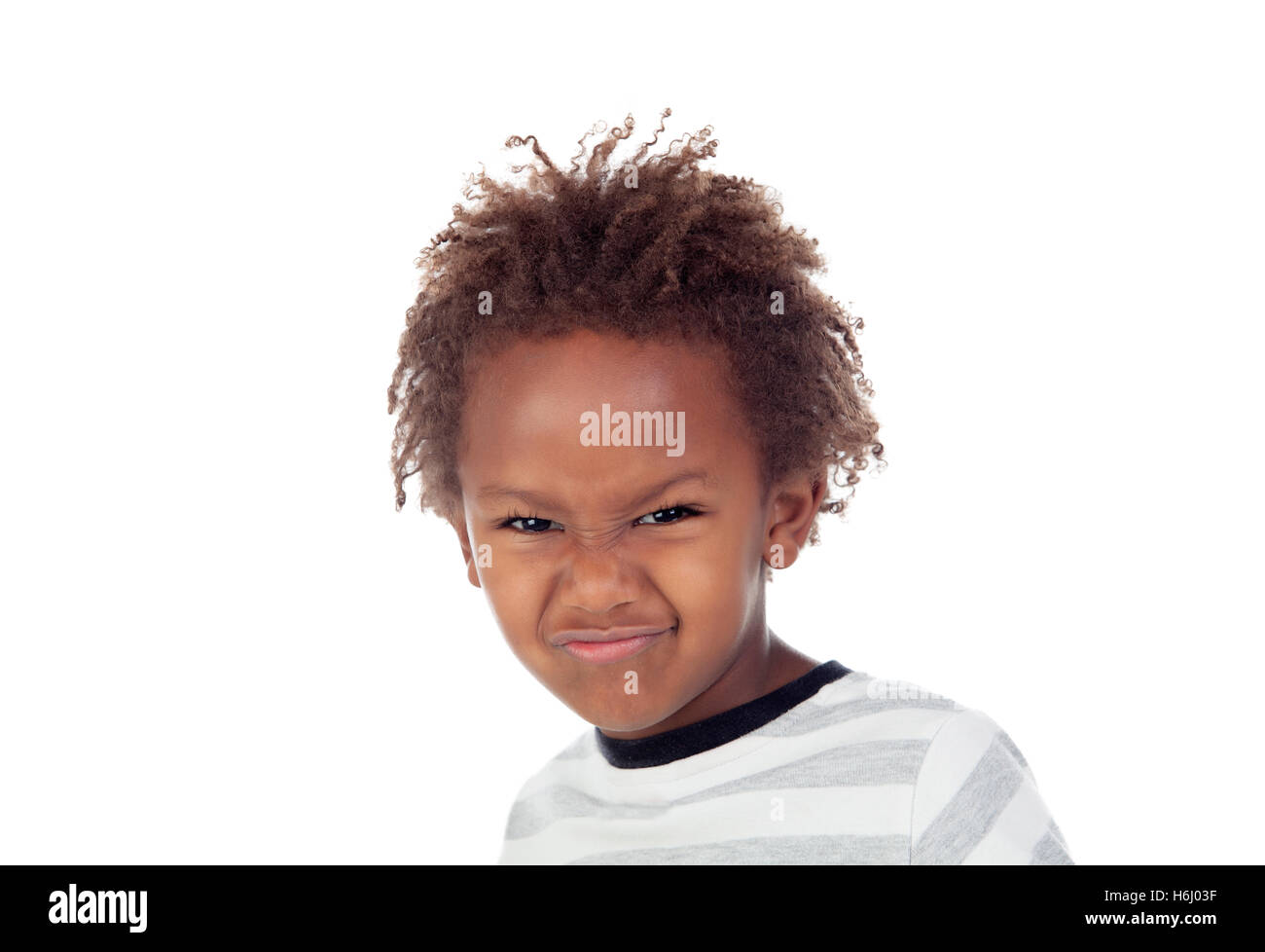 African child putting mean face isolated on white background Stock ...