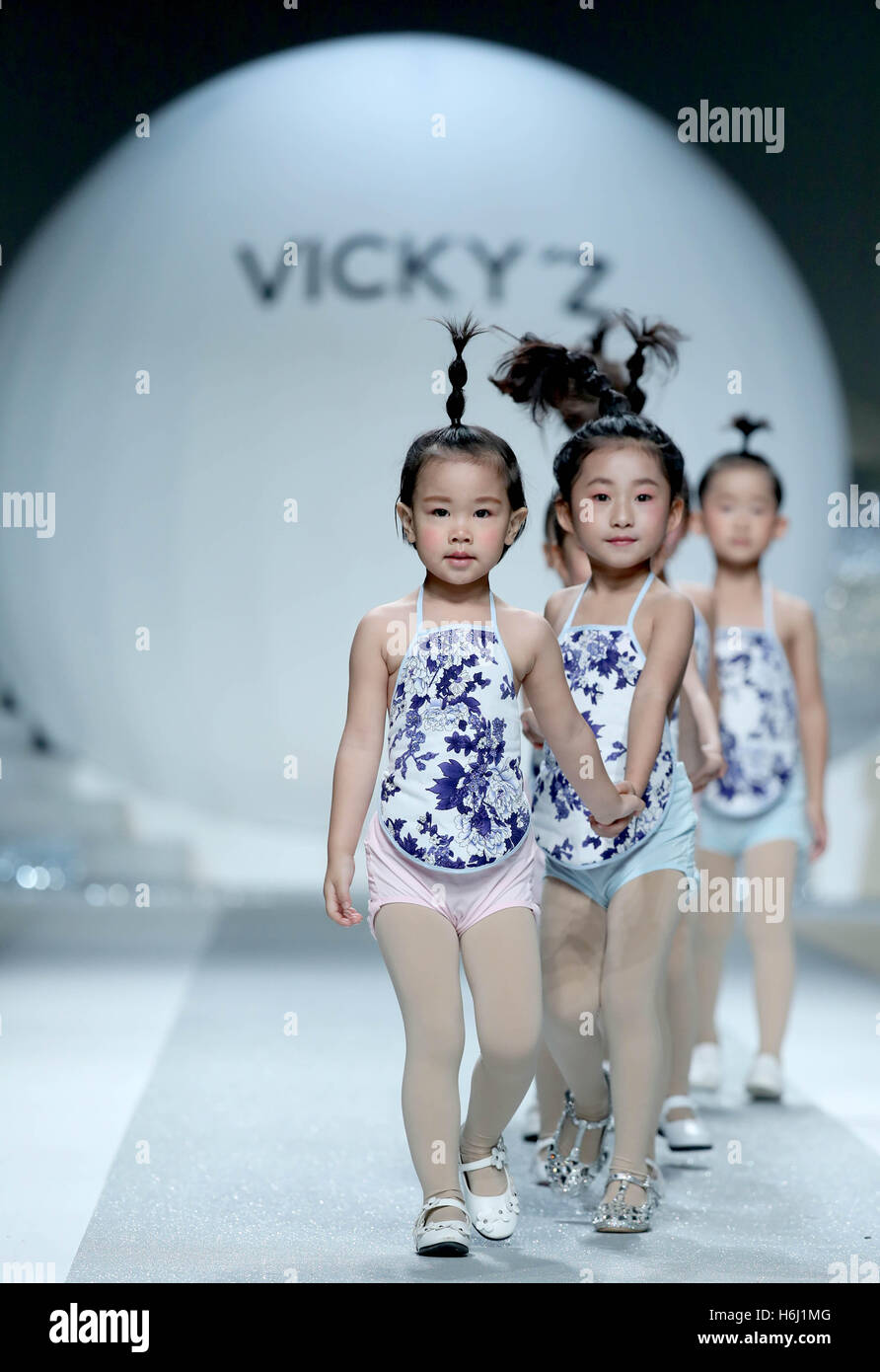 Beijing, China. 29th Oct, 2016. Models present the parent-child outfits ...