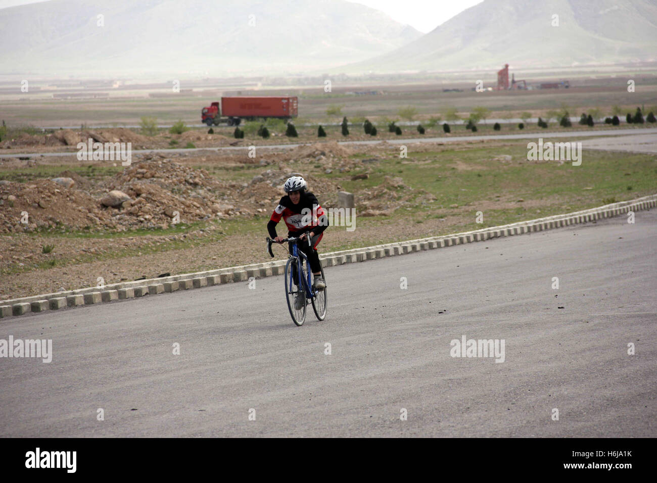 Kabul, Afghanistan. 06th May, 2016. A woman on the road bike team takes ...