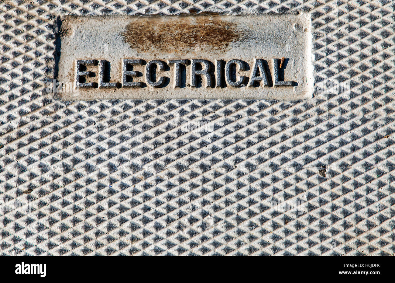 Bumpy metal surface with the text "electrical" on it Stock Photo - Alamy