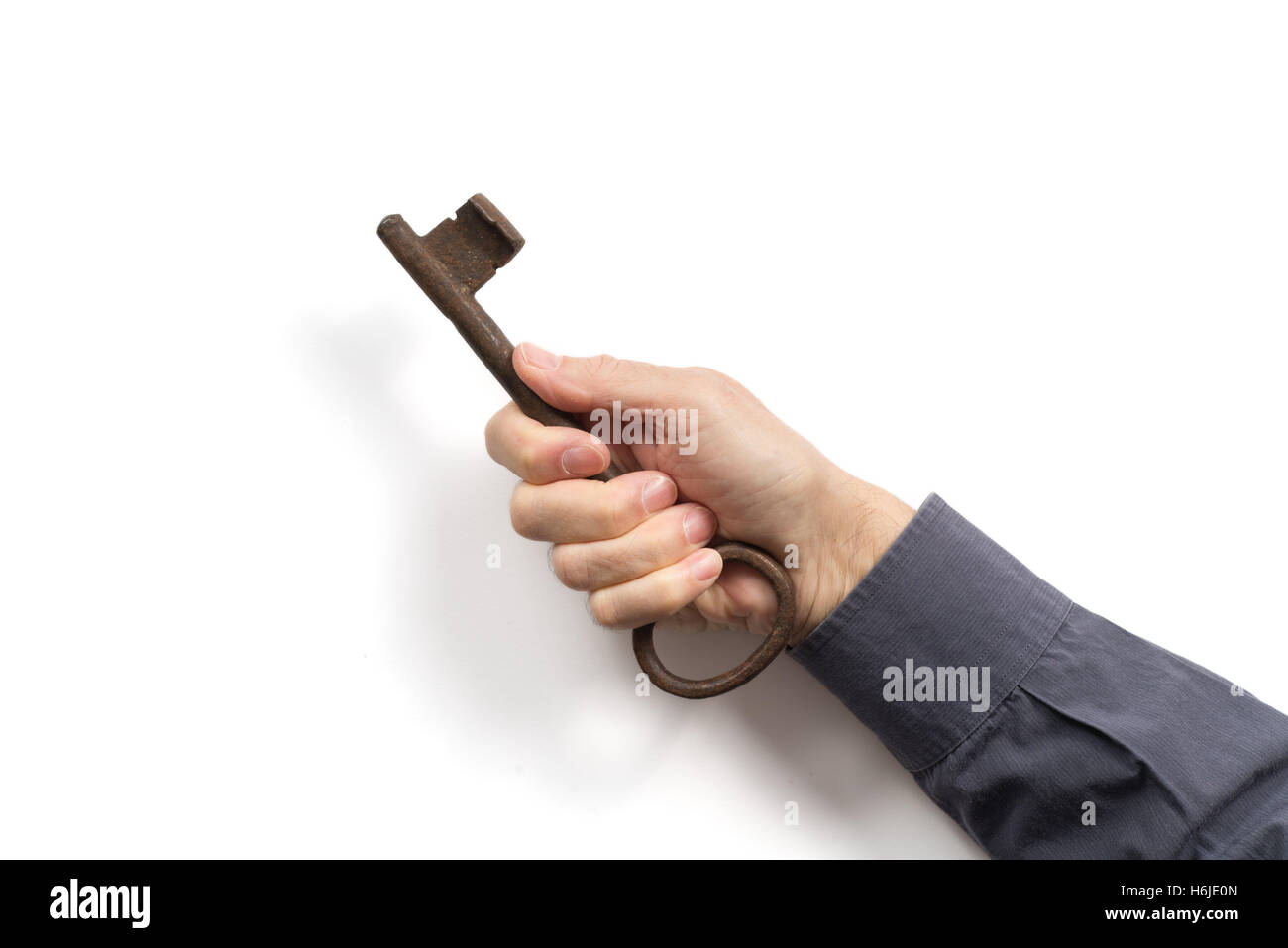 Hand holding skeleton key hi-res stock photography and images - Alamy