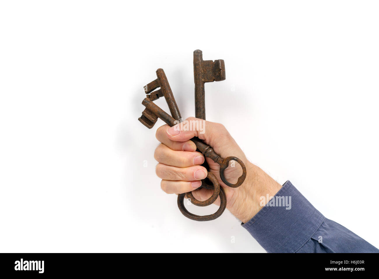 Hand holding skeleton key hi-res stock photography and images - Alamy