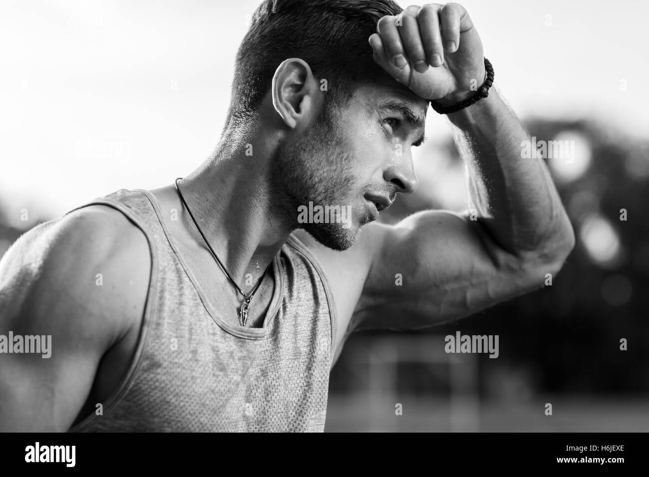 Black-and-white portrait of tired muscular male Stock Photo - Alamy