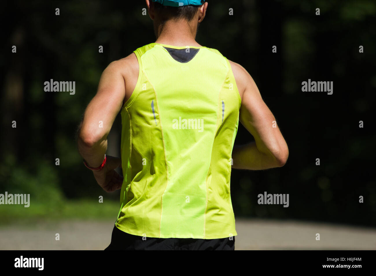 Athlete male runner running outdoors, rear view Stock Photo - Alamy