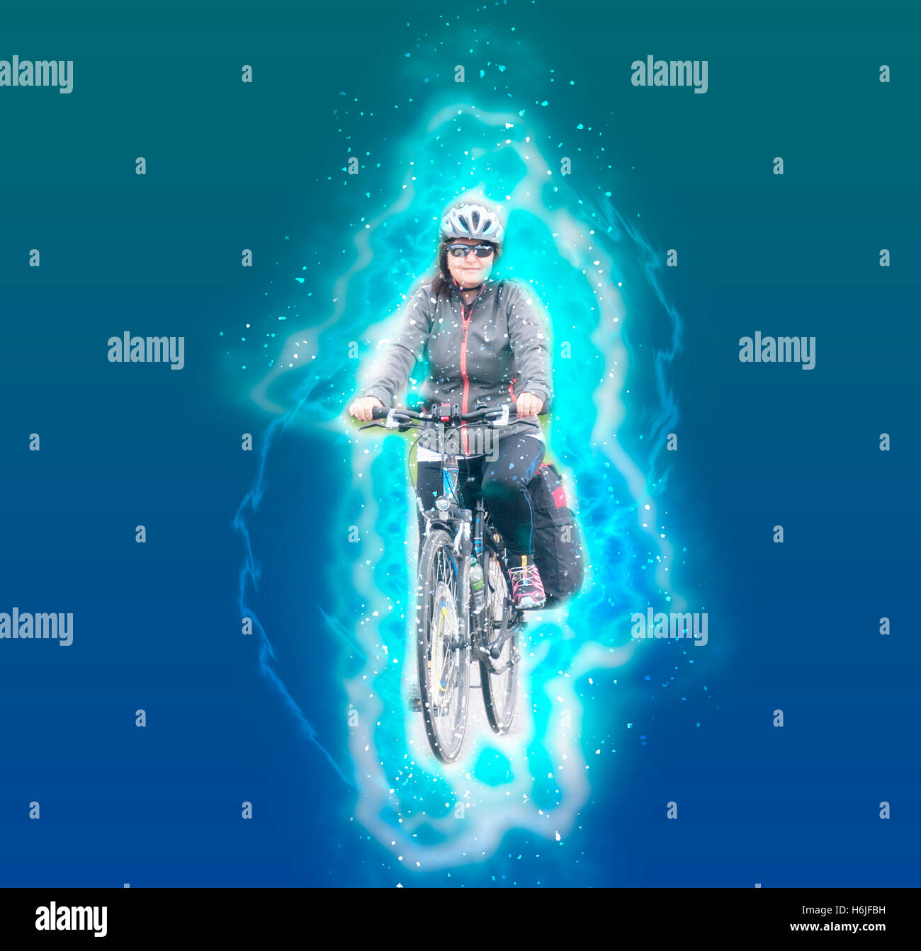 Digitally enhanced image Of a woman riding a bicycle model release ...