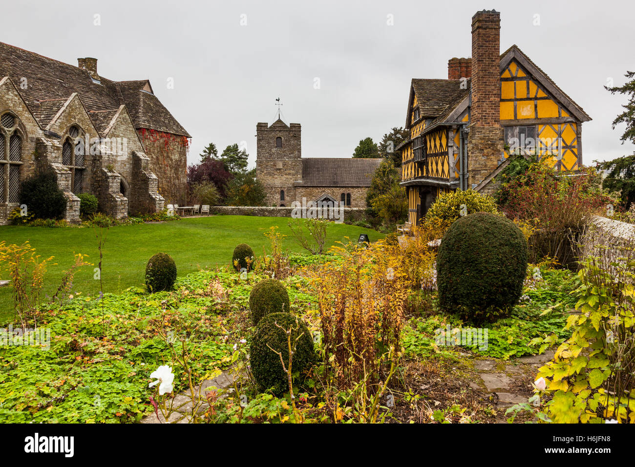 The timber-framed gatehouse at Stokesay Castle, with St John the ...